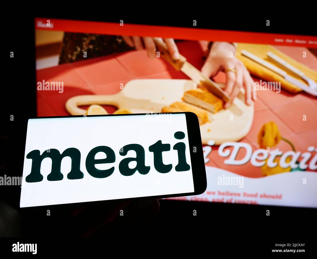 Person holding cellphone with logo of American nutrition company Meati ...