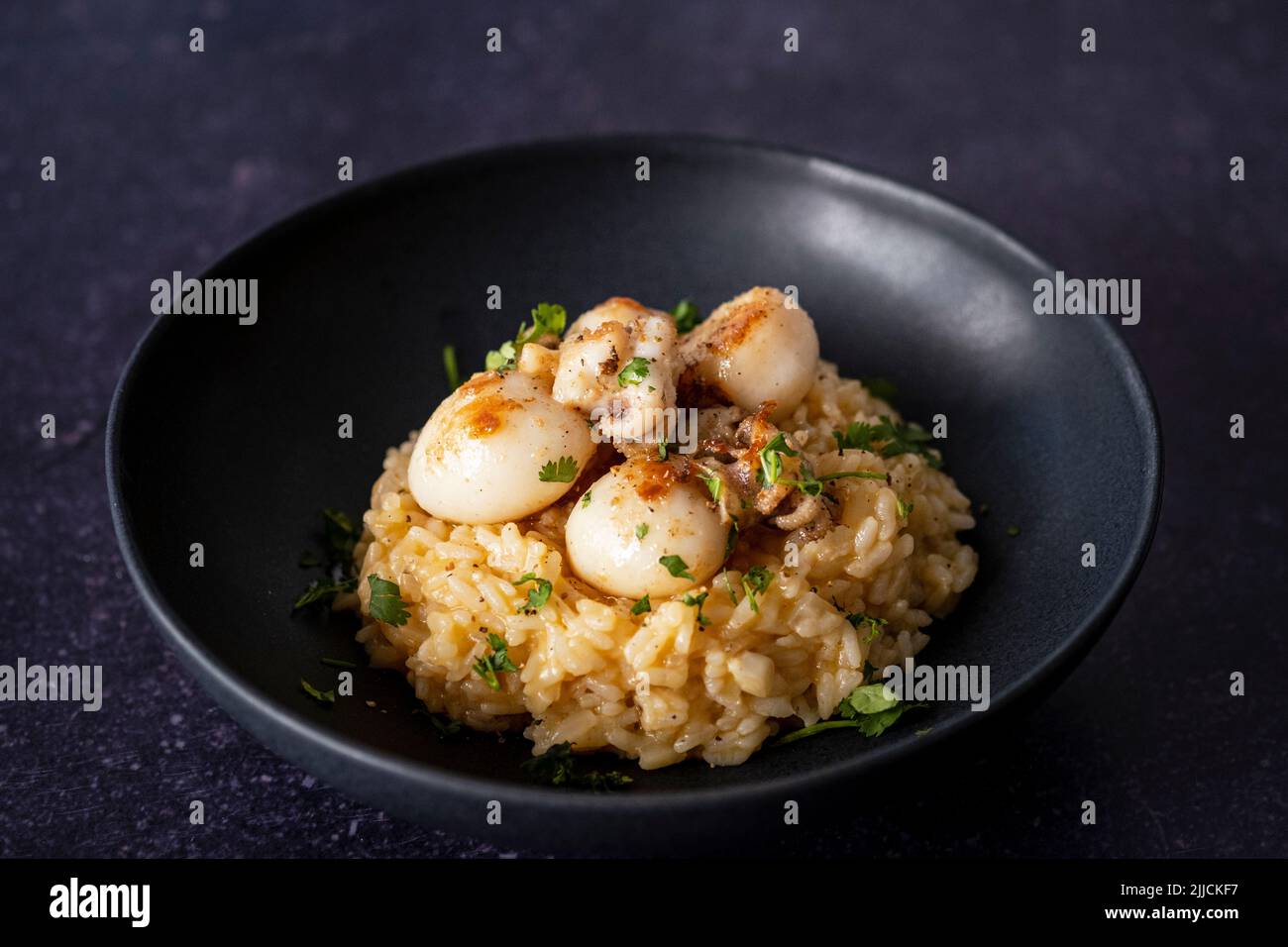 Cuttlefish risotto with garlic butter Stock Photo - Alamy