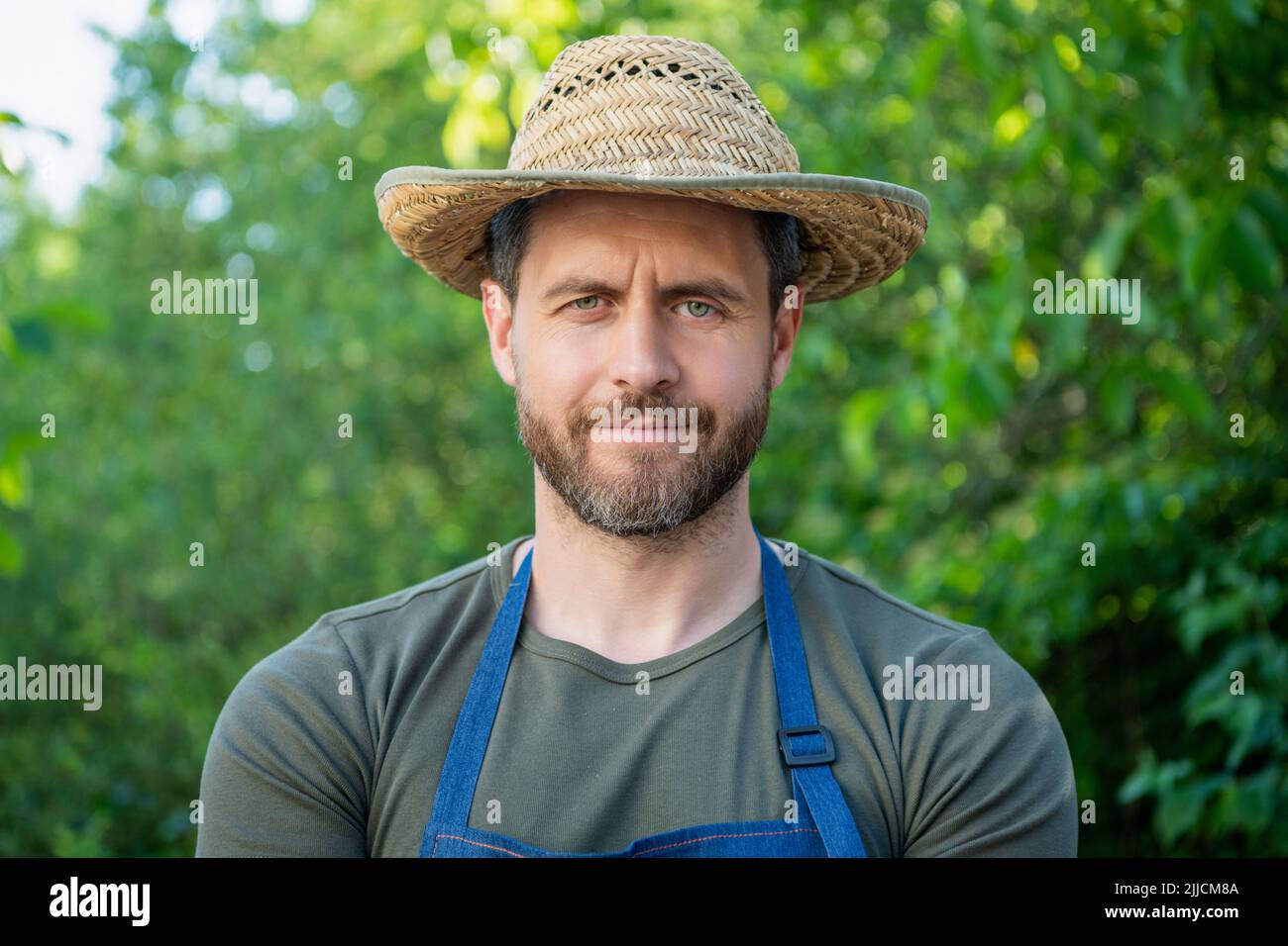 Portrait of serious farmer man in farmers hat natural outdoors Stock ...
