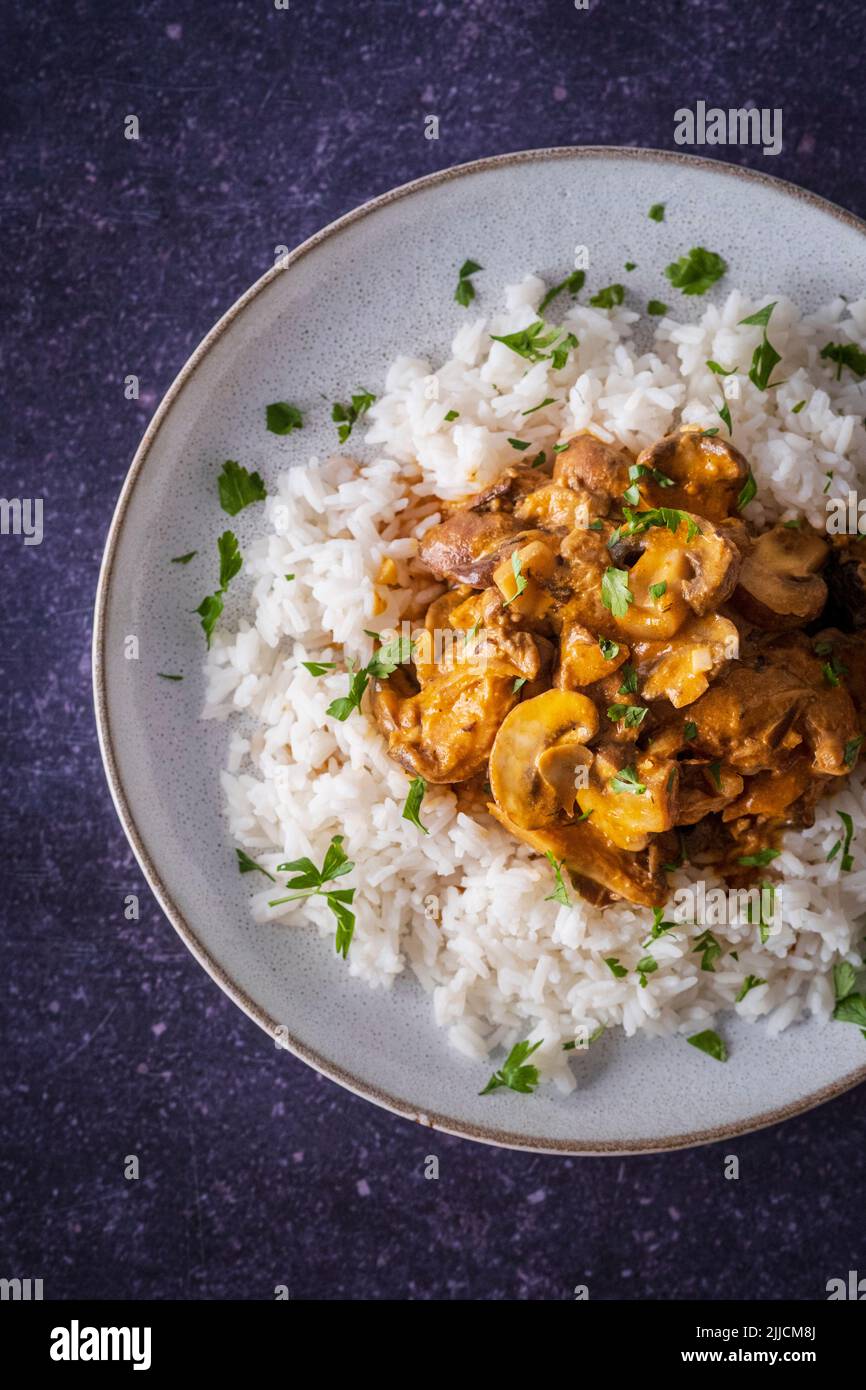 Mushroom goulash with white rice Stock Photo - Alamy