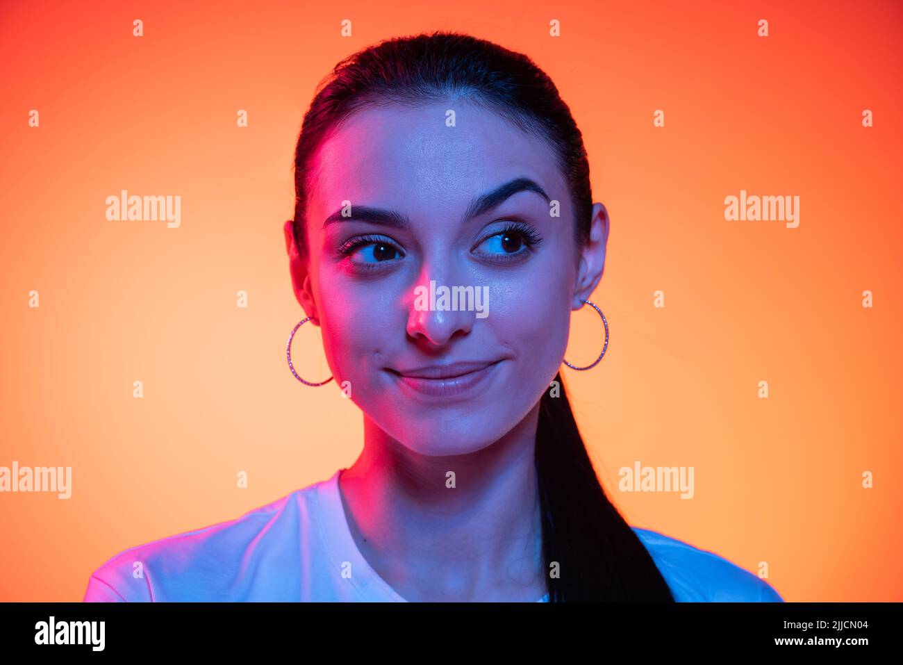 Closeup face of young attractive girl looking at camera isolated on ...