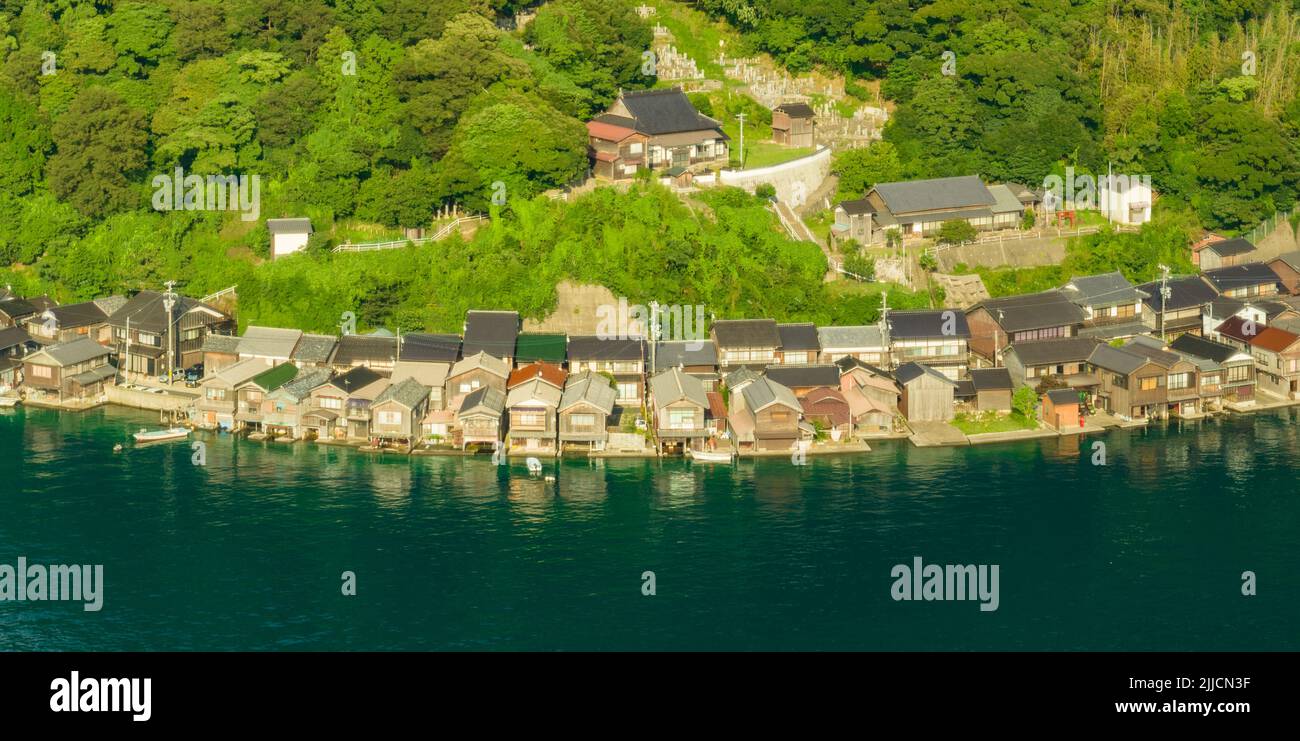 Aerial view of boathouses in row along coast at Ine, Kyoto Stock Photo ...