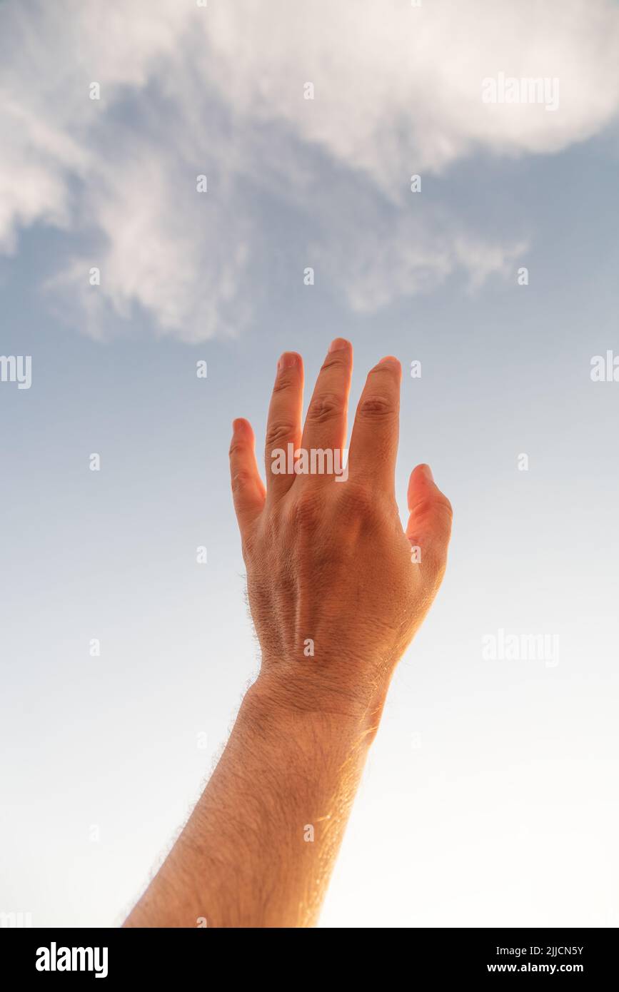 male hand reaching out in summer Stock Photo - Alamy