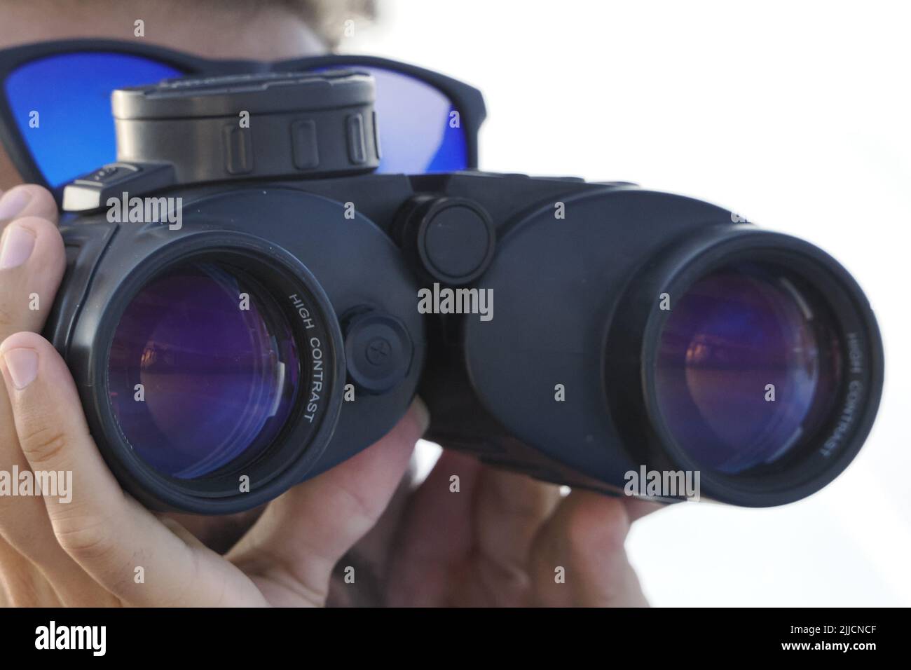 Close up hand holding binoculars hi-res stock photography and images ...