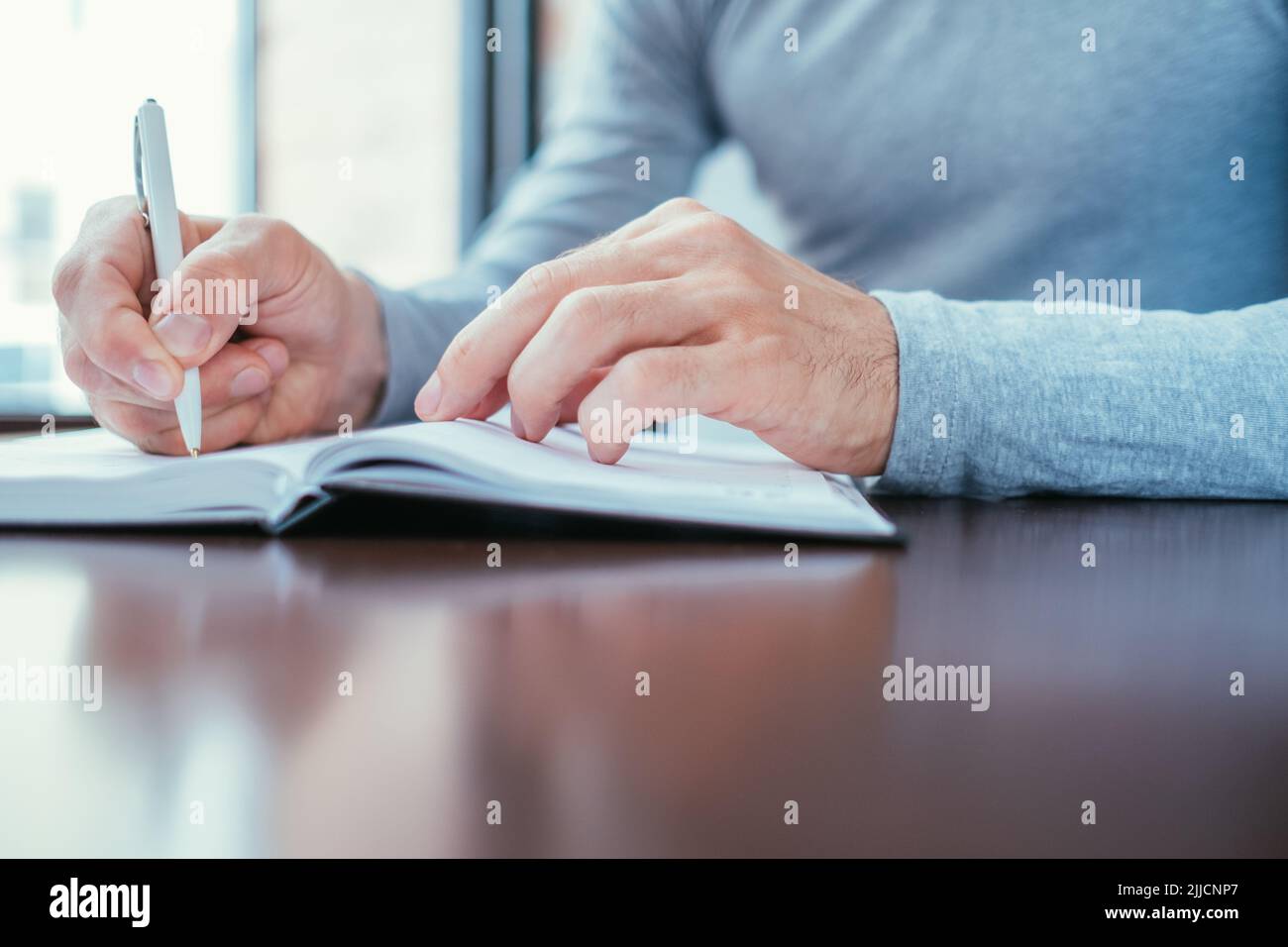 man writing organizer plan information structure Stock Photo - Alamy