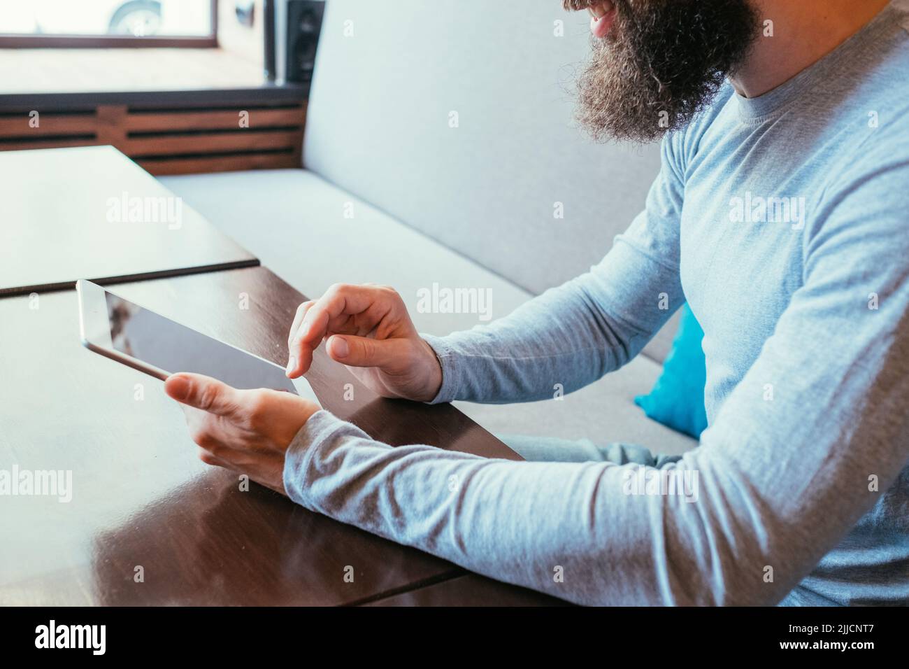 man holding tablet mobility online internet access Stock Photo - Alamy