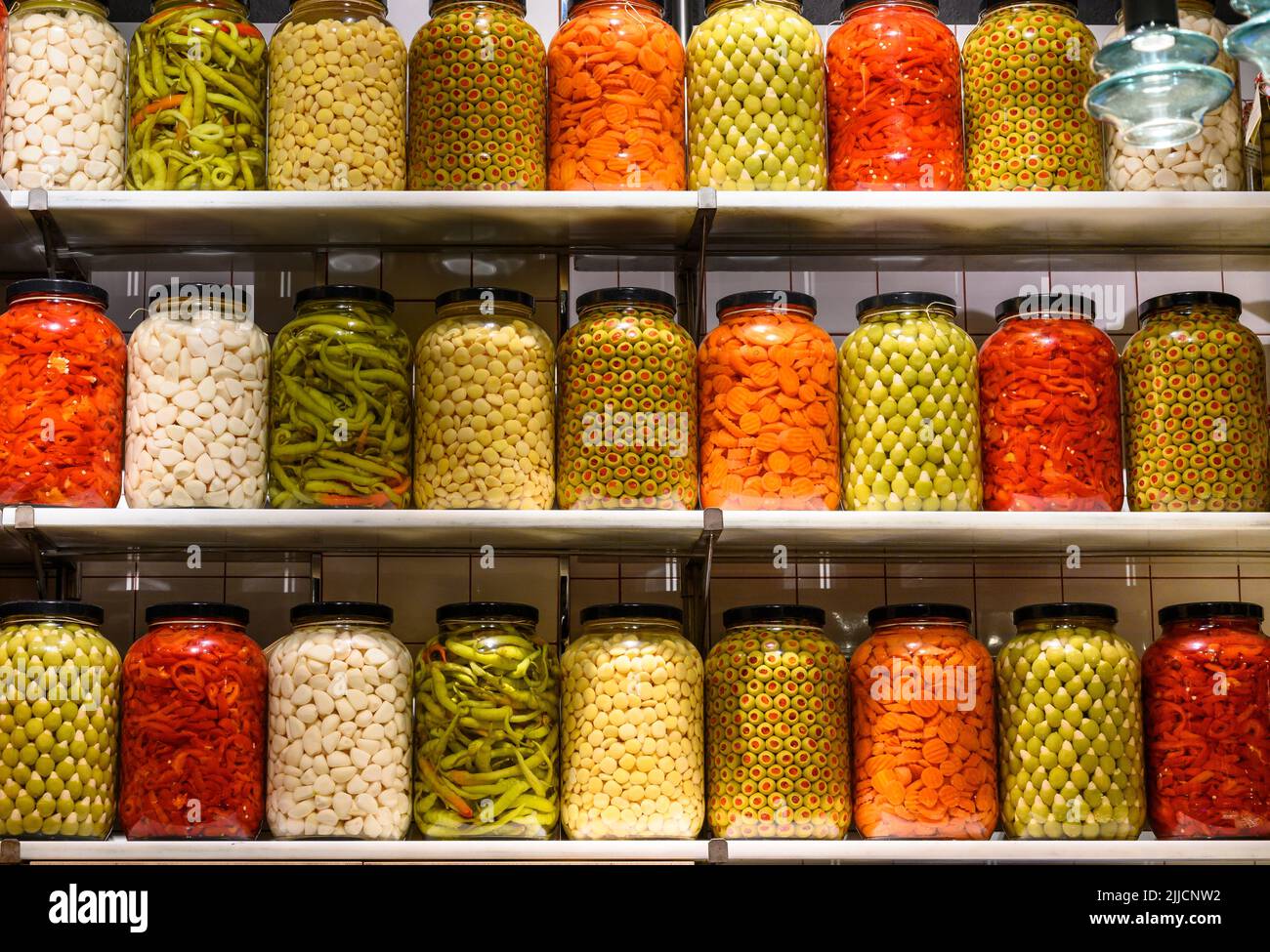 A colourful selection of pickles in jars on display in the Mercardo de ...