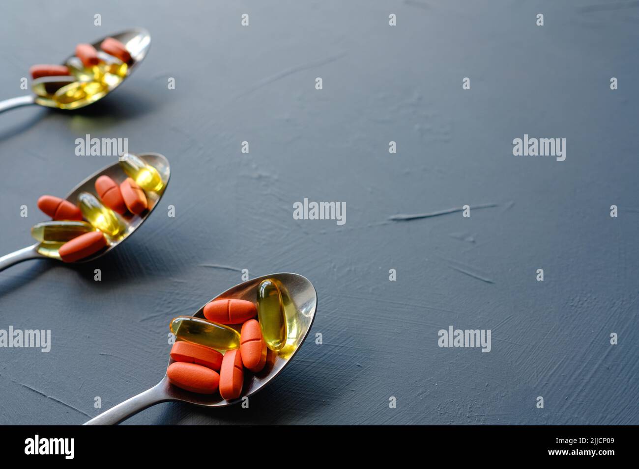 pills capsules spoon medication illness cure Stock Photo - Alamy