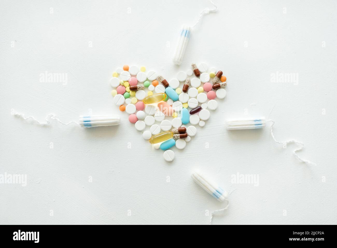 menstrual cramps medication mix pills tampon white Stock Photo - Alamy