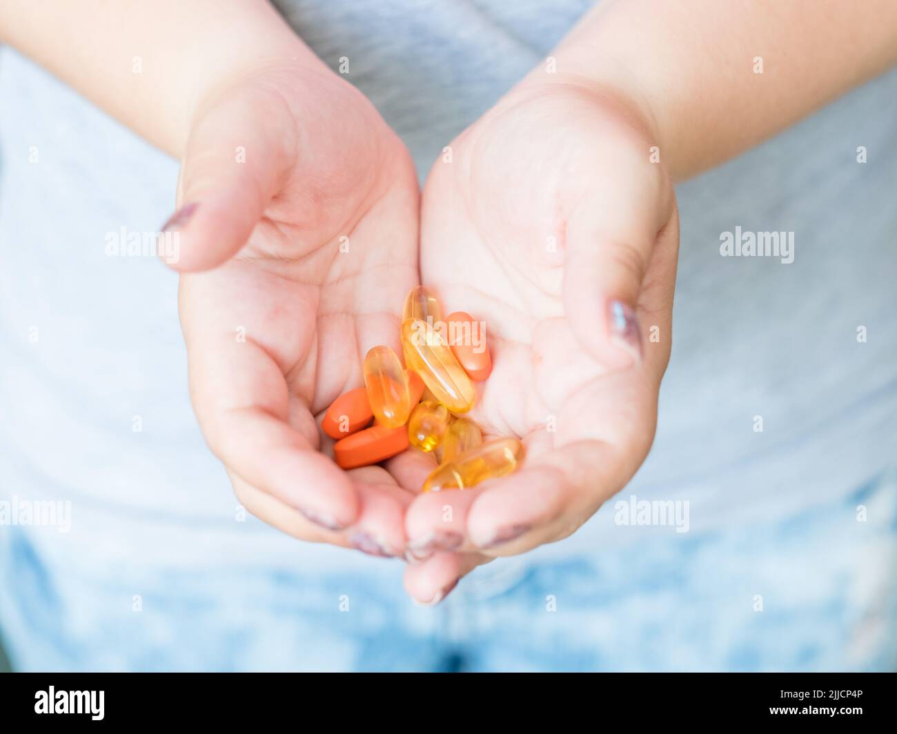 pills capsules hands medication illness cure Stock Photo - Alamy