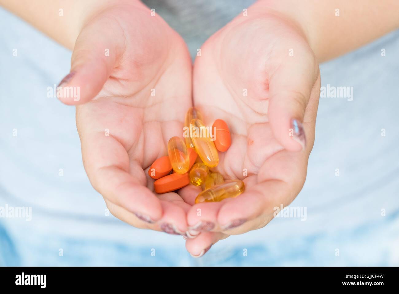 pills capsules hands healthcare disease treatment Stock Photo - Alamy