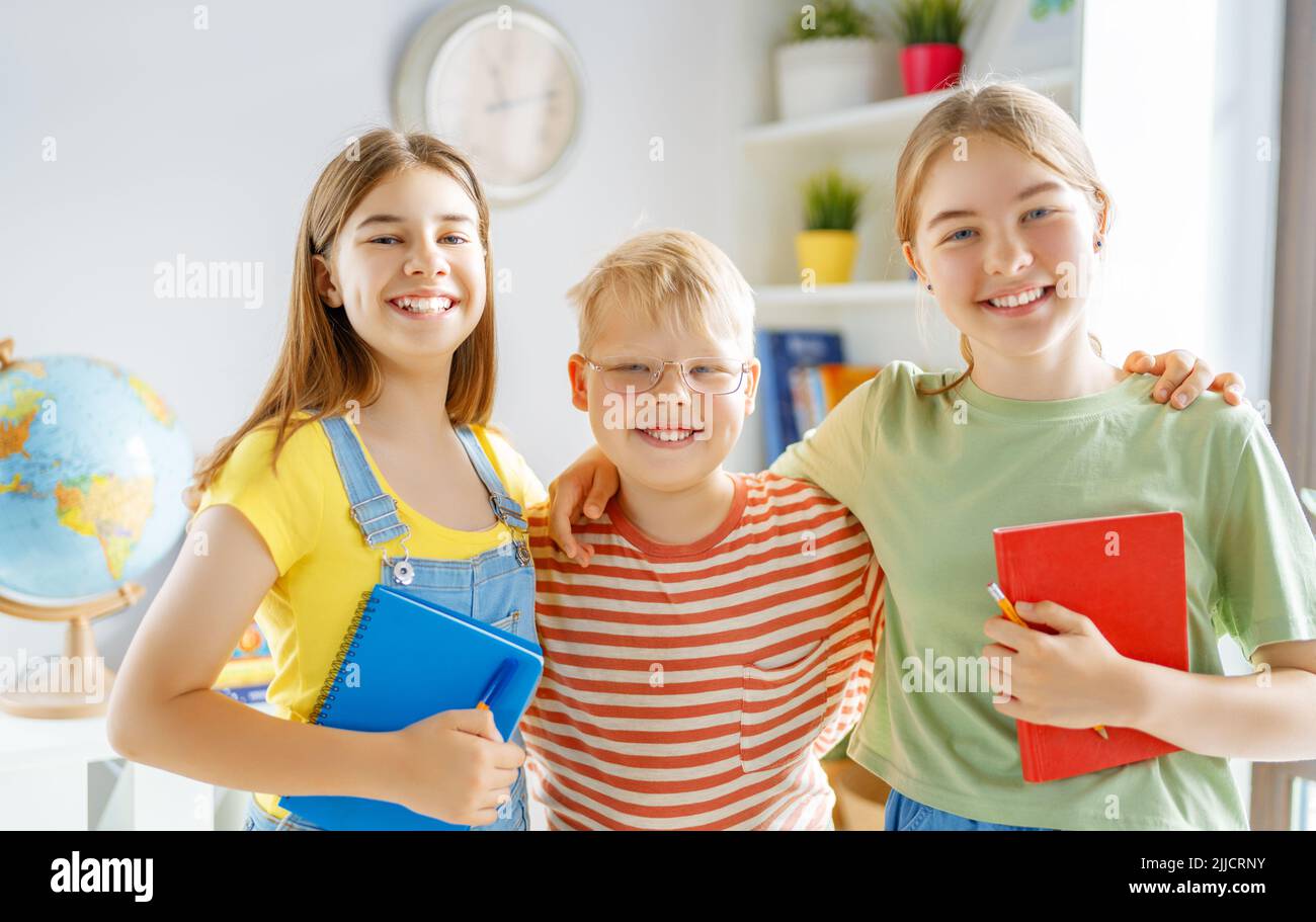 Happy kids at school. Children are working in the class Stock Photo - Alamy