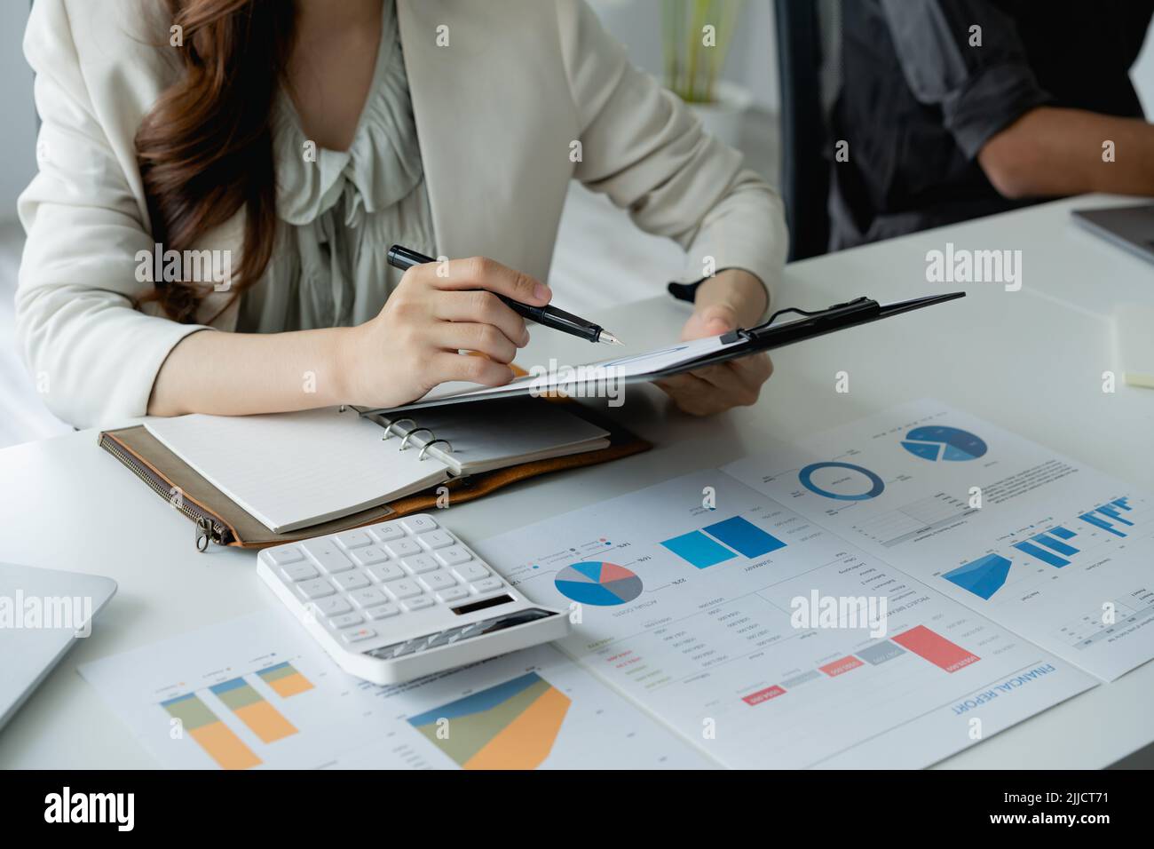 Close up young casual business accountant bookkeeper in office looking ...