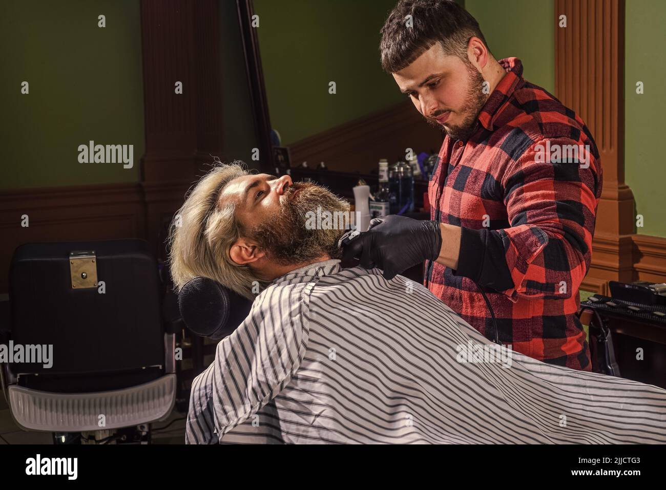 Barber is essential resource for your style. Shaving with razor. Facial ...