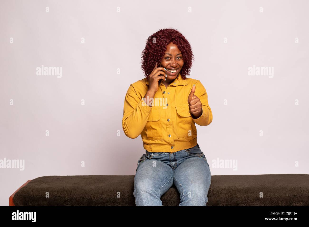 excited young black woman making a phone call Stock Photo - Alamy excited young black woman making a phone call Stock Photo - Alamy