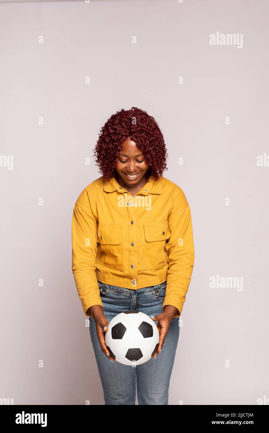 African model holding a football hi-res stock photography and images ...