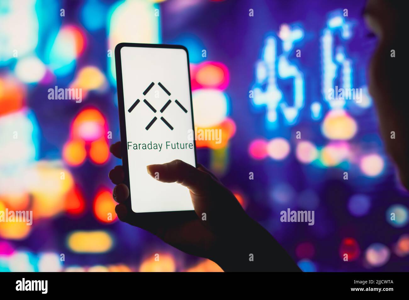 In this photo illustration, the Faraday Future logo is displayed on a smartphone screen Stock ...