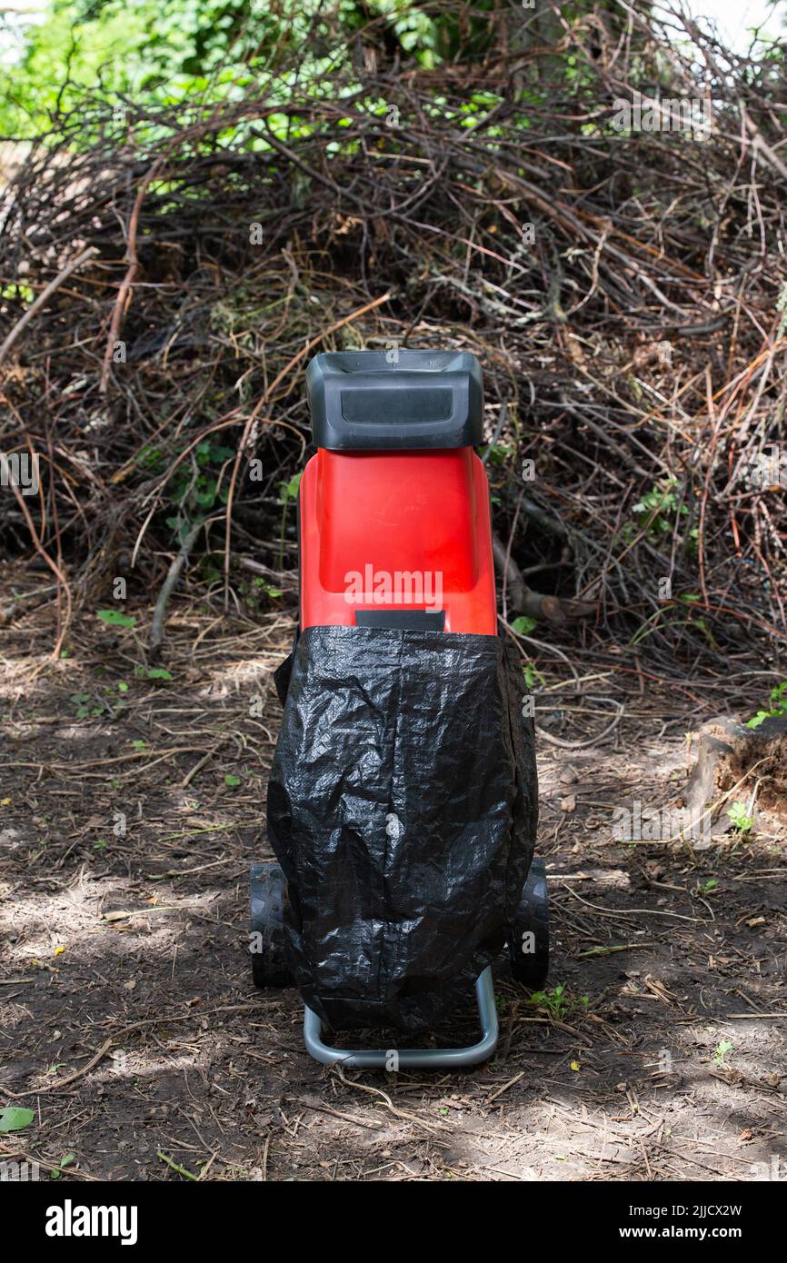 Garden chipper, electric shredder mulcher against the background of a ...