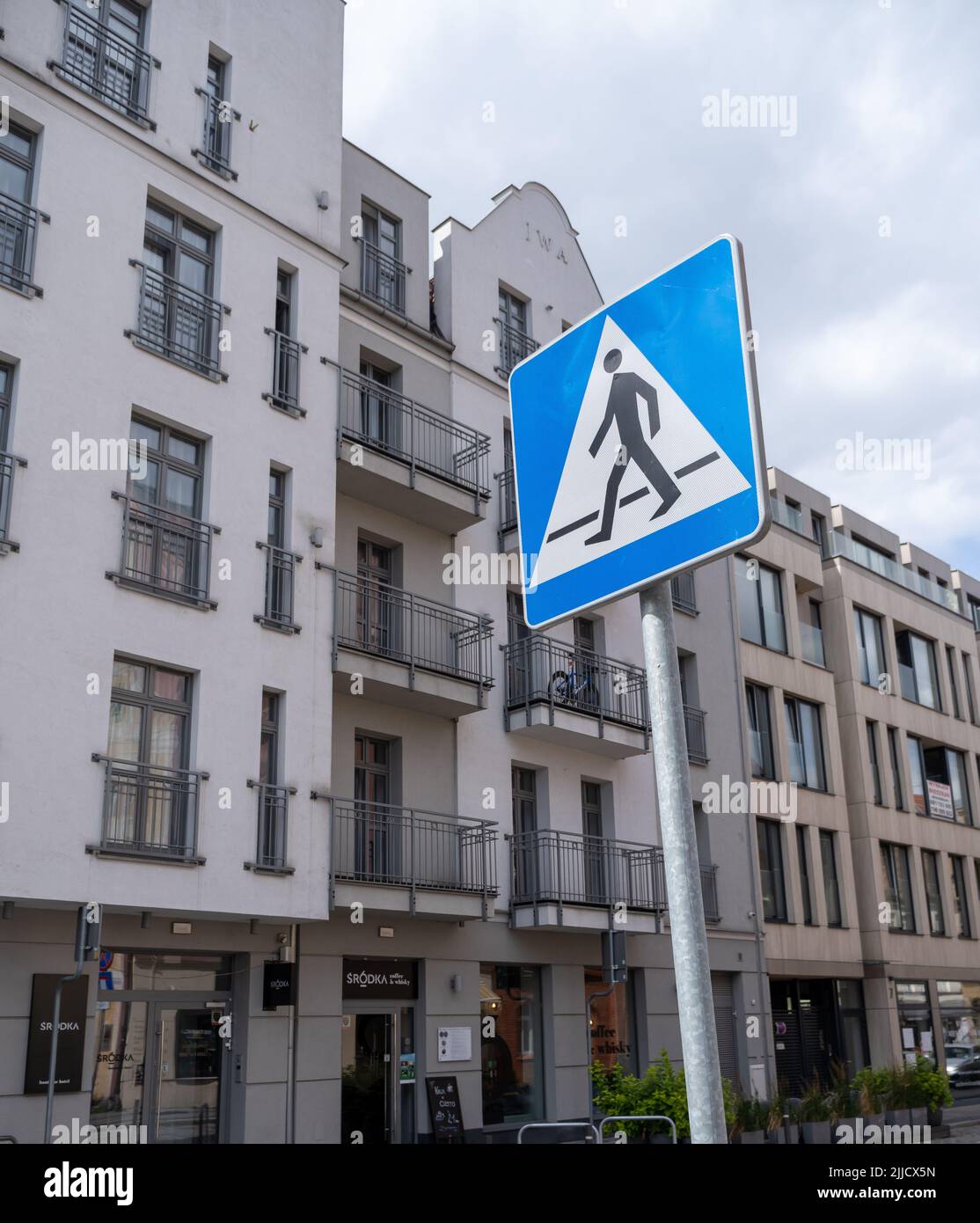 A zebra crossing sign on the background of an apartment building Stock ...