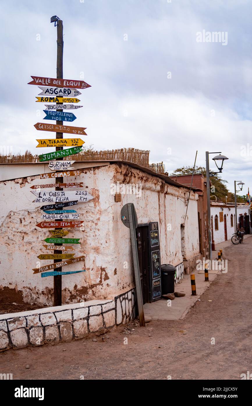 A vertical shot of street signs in San Pedro de Atacama, Chile Stock ...