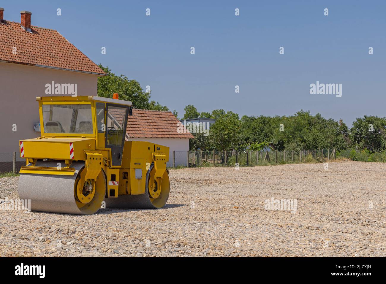 Yellow Compaction Double Roller Machine at New Construction Site Stock ...