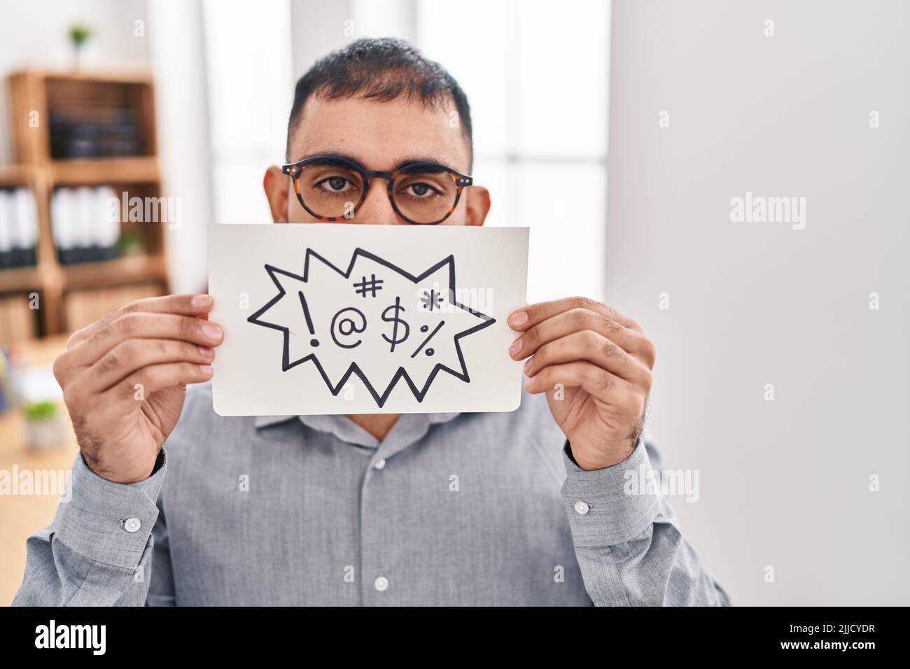 Middle east man with beard holding banner with swear words puffing ...