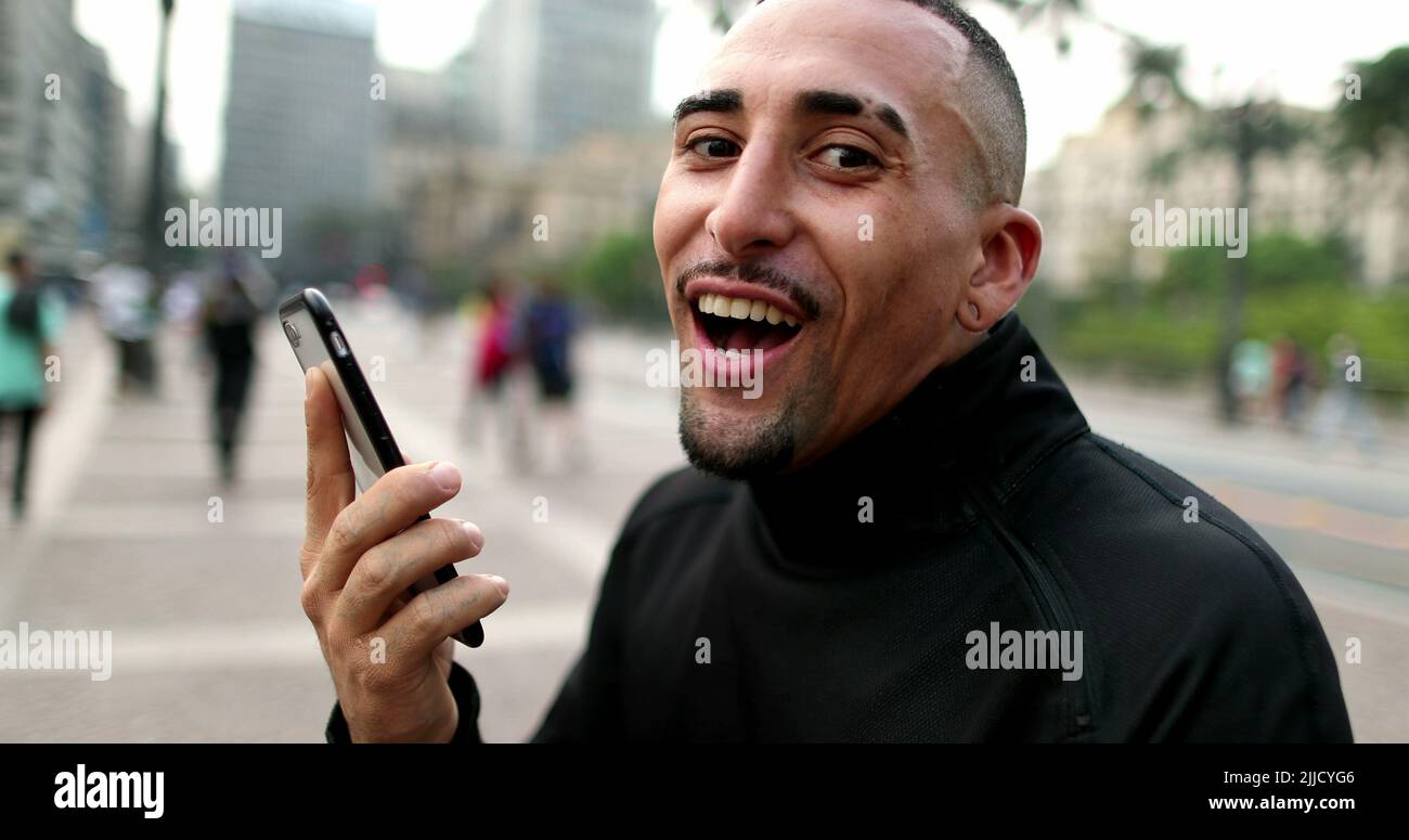 Happy hispanic man receiving hi-res stock photography and images - Alamy