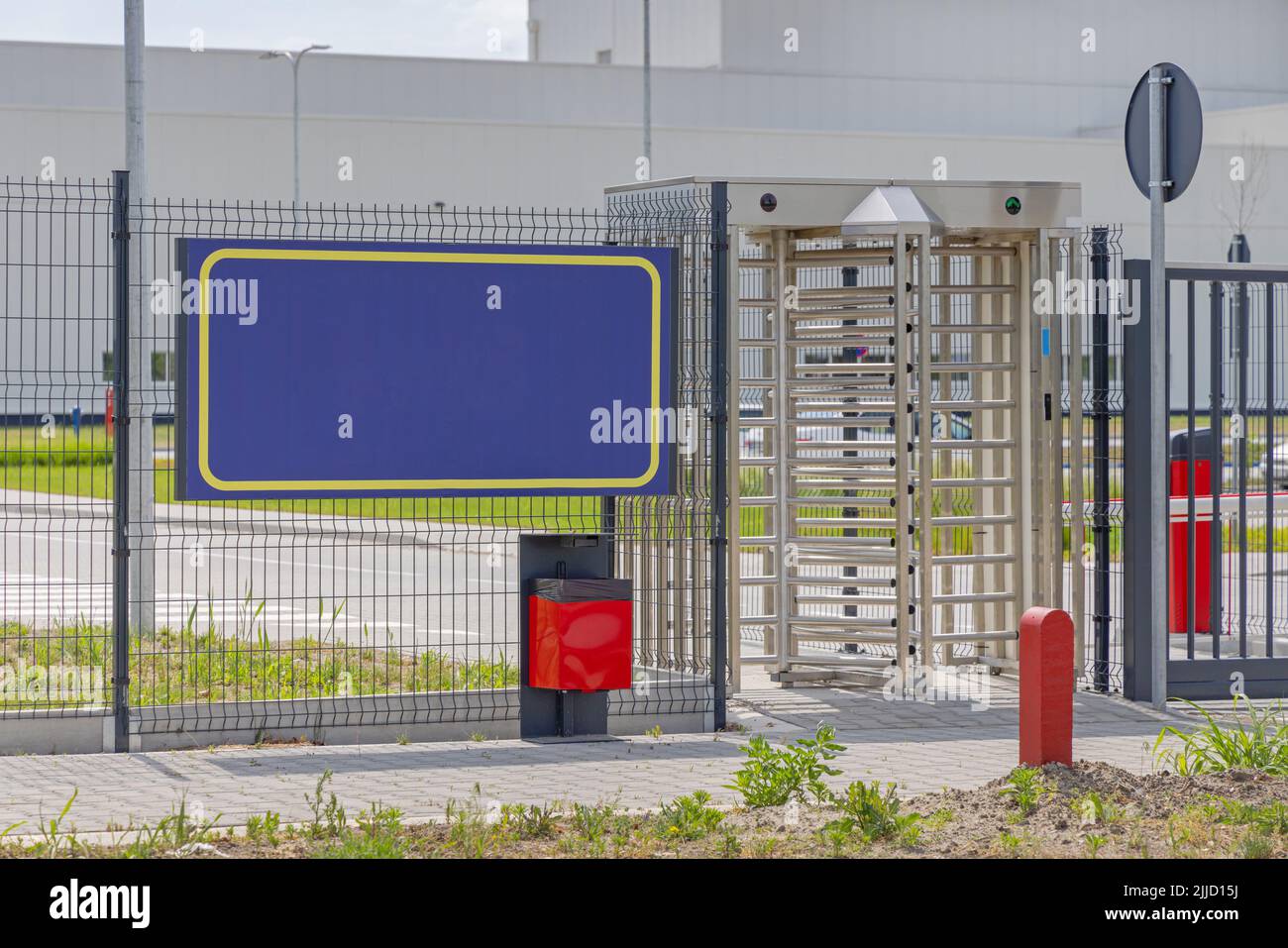 Workers Entrance Turnstile Doors at Factory Gate Fence Stock Photo - Alamy