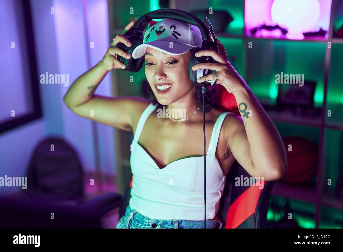 Young beautiful hispanic woman streamer smiling confident holding ...