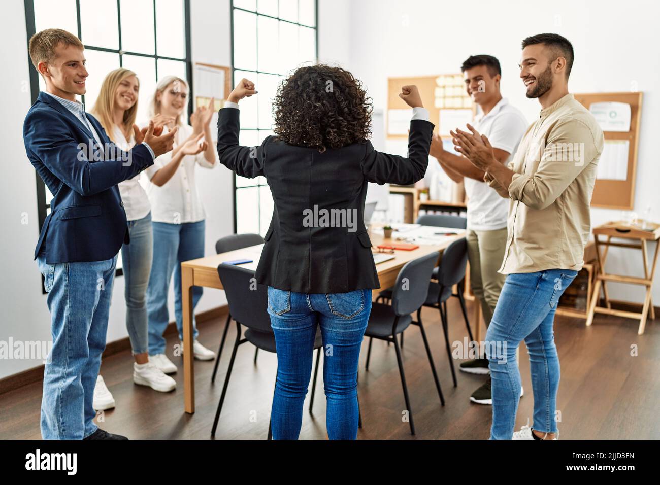 Group of young business workers smiling and clapping. Young ...