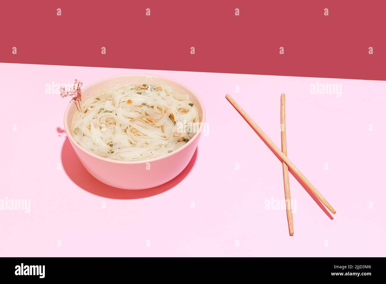 Delicious image of noodles isolated over pink background. Japanese ...