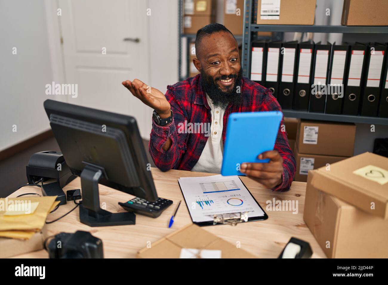 African american man working at small business ecommerce doing video ...