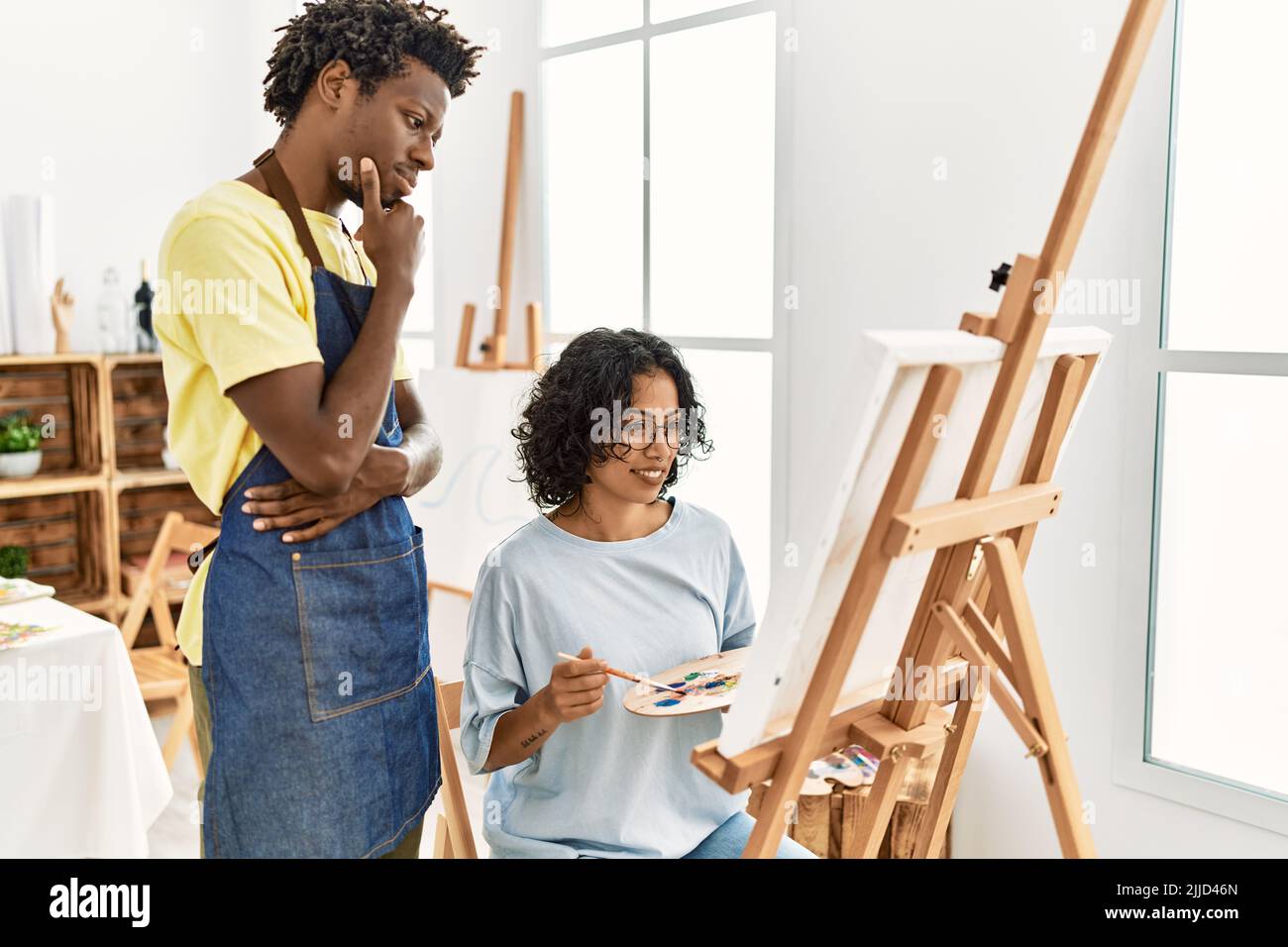 Artist teacher and student painting at art studio Stock Photo - Alamy