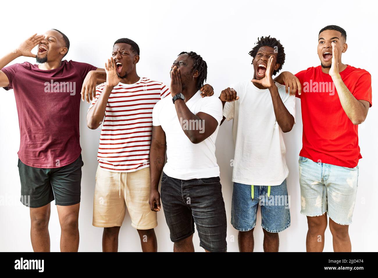 Young african group of friends standing together over isolated ...