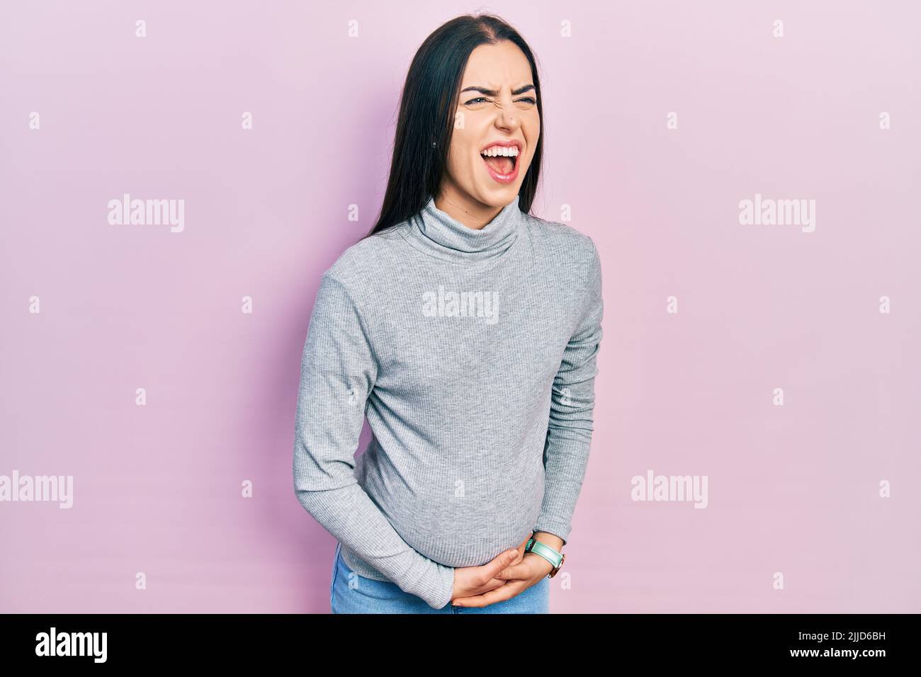 Beautiful woman with blue eyes expecting a baby, touching pregnant ...