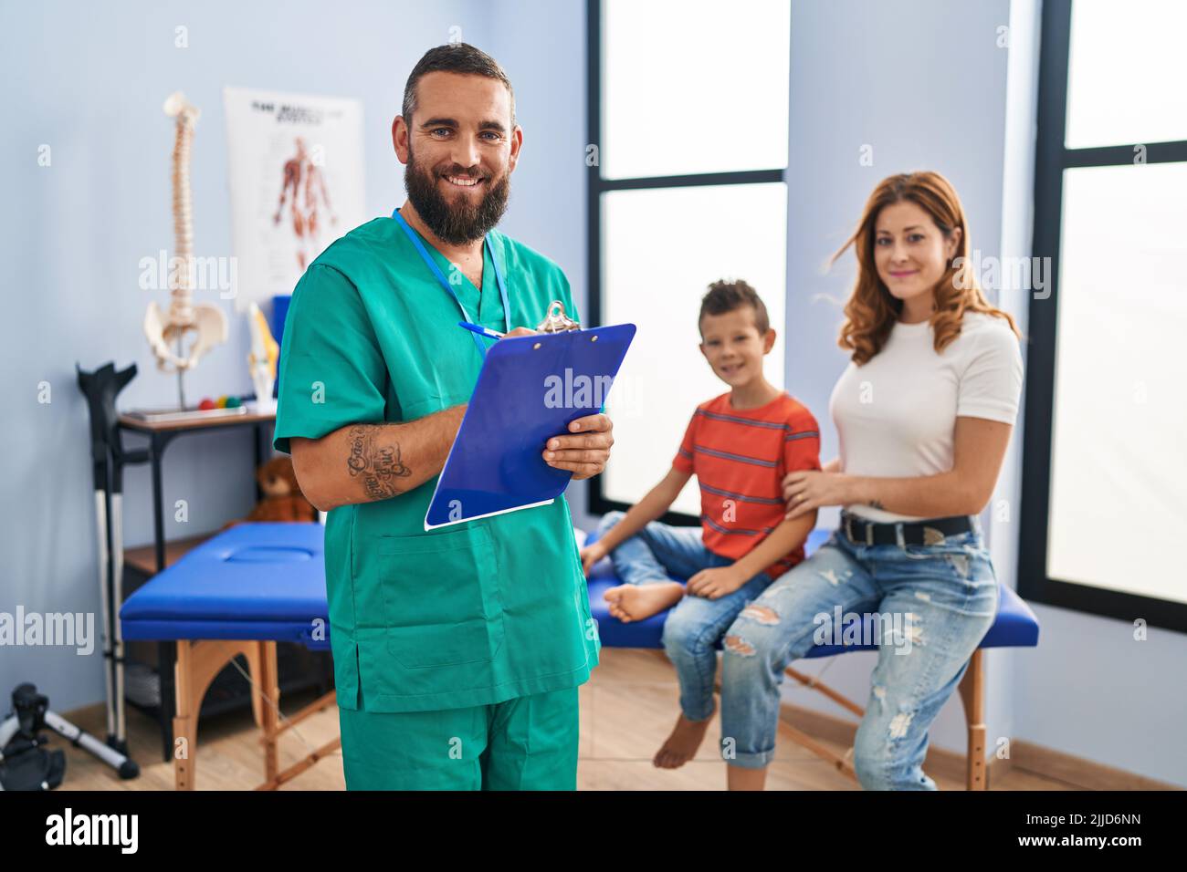 Family having physiotherapy session at rehab clinic Stock Photo - Alamy