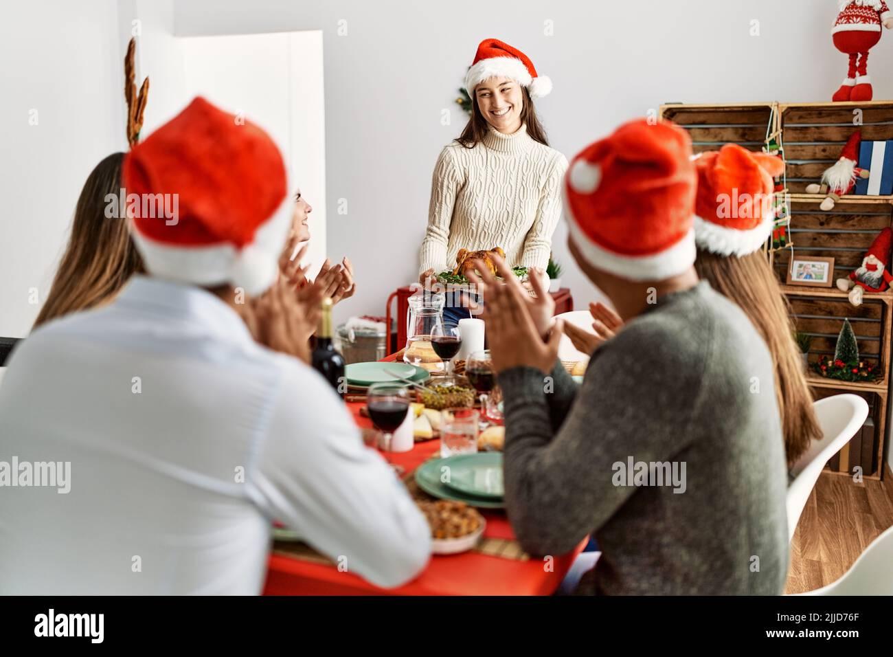 Group of people meeting clapping and sitting on the table. Woman ...