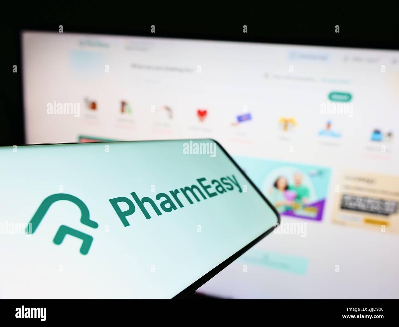Mobile phone with logo of Indian e-commerce company PharmEasy on screen ...