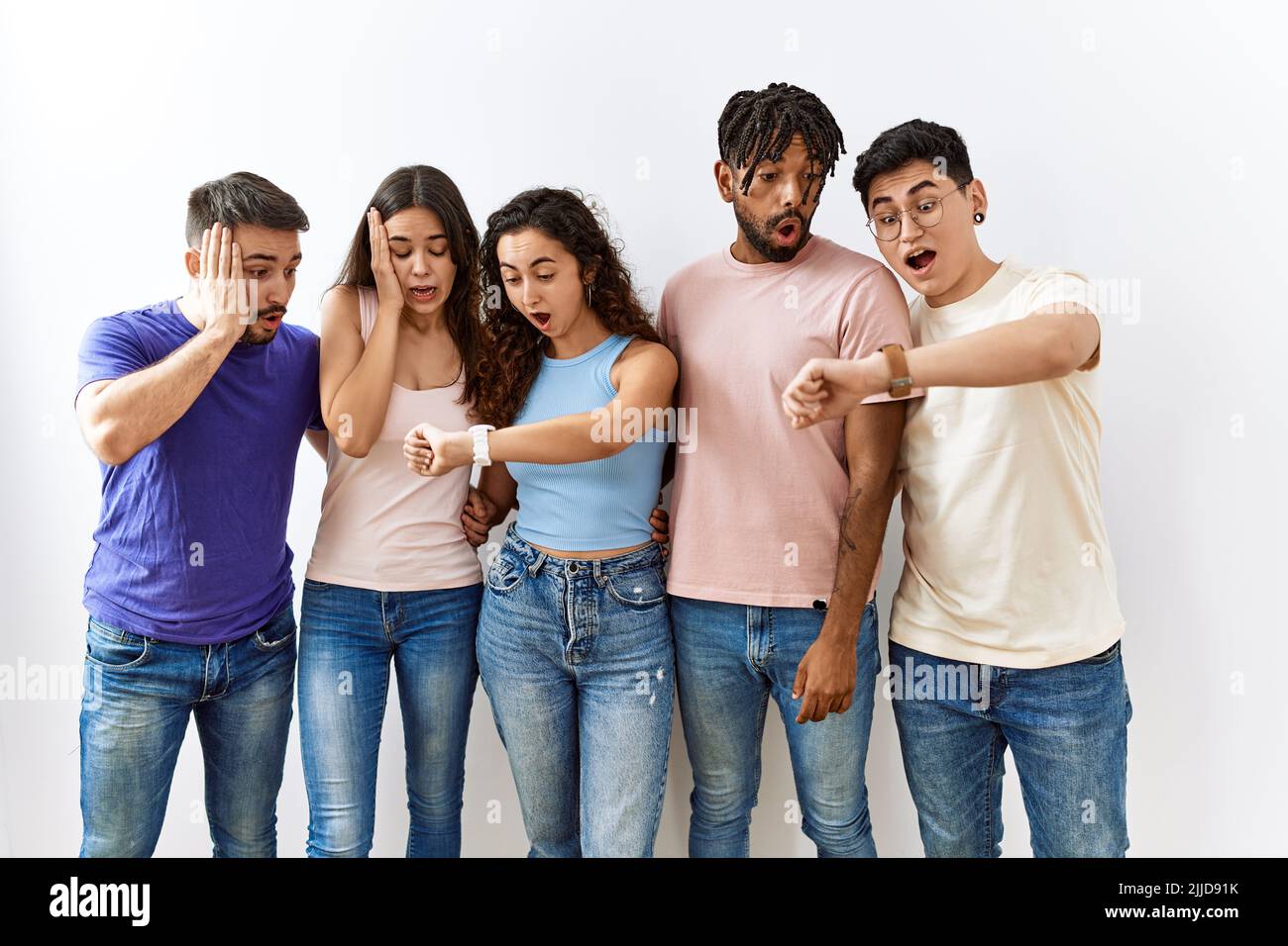 Group of young people standing together over isolated background ...