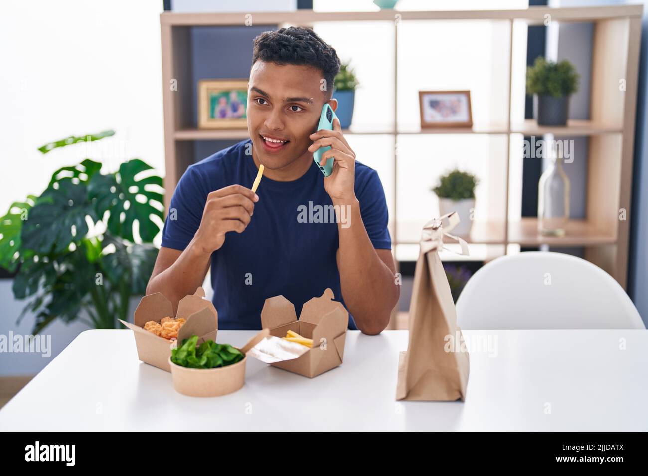Man bag eating chips hi-res stock photography and images - Alamy