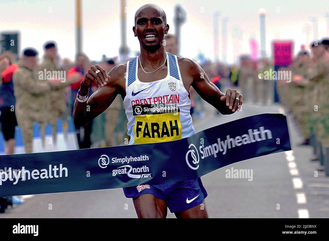 Sir mo farah crossing the finishing line in first place hi-res stock ...