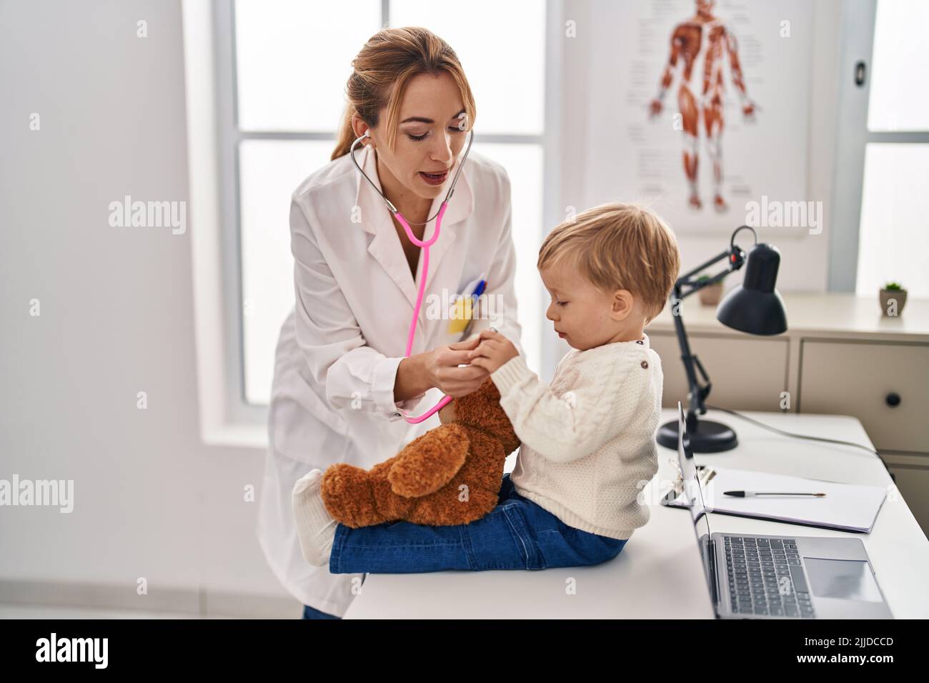 Mother and son having pediatrician consultation at clinic Stock Photo ... Mother and son having pediatrician consultation at clinic Stock Photo ...