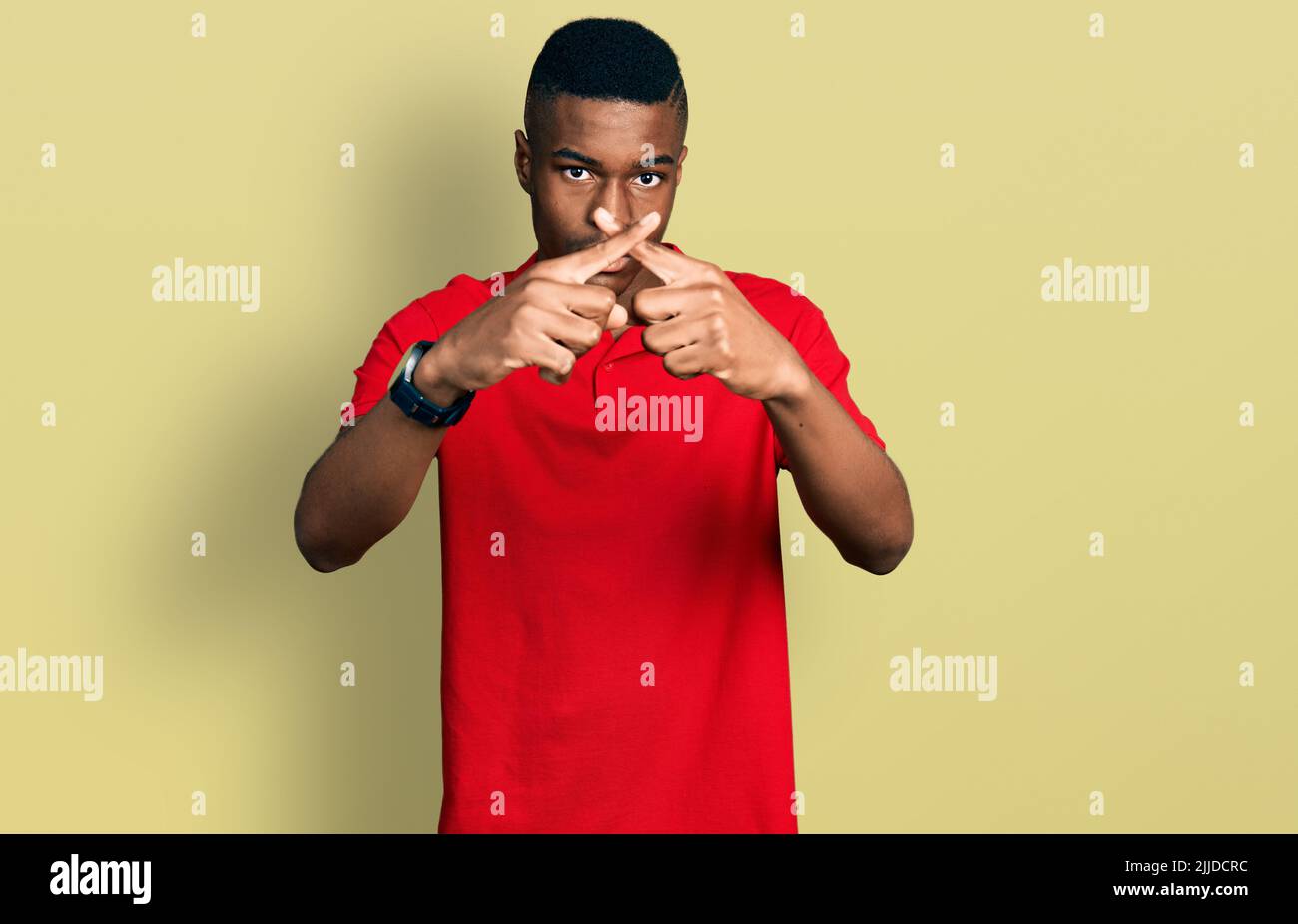 Young african american man wearing casual red t shirt rejection ...