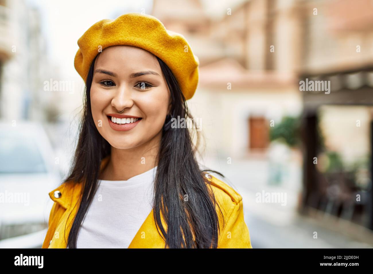 Young latin girl smiling happy standing at the city Stock Photo - Alamy