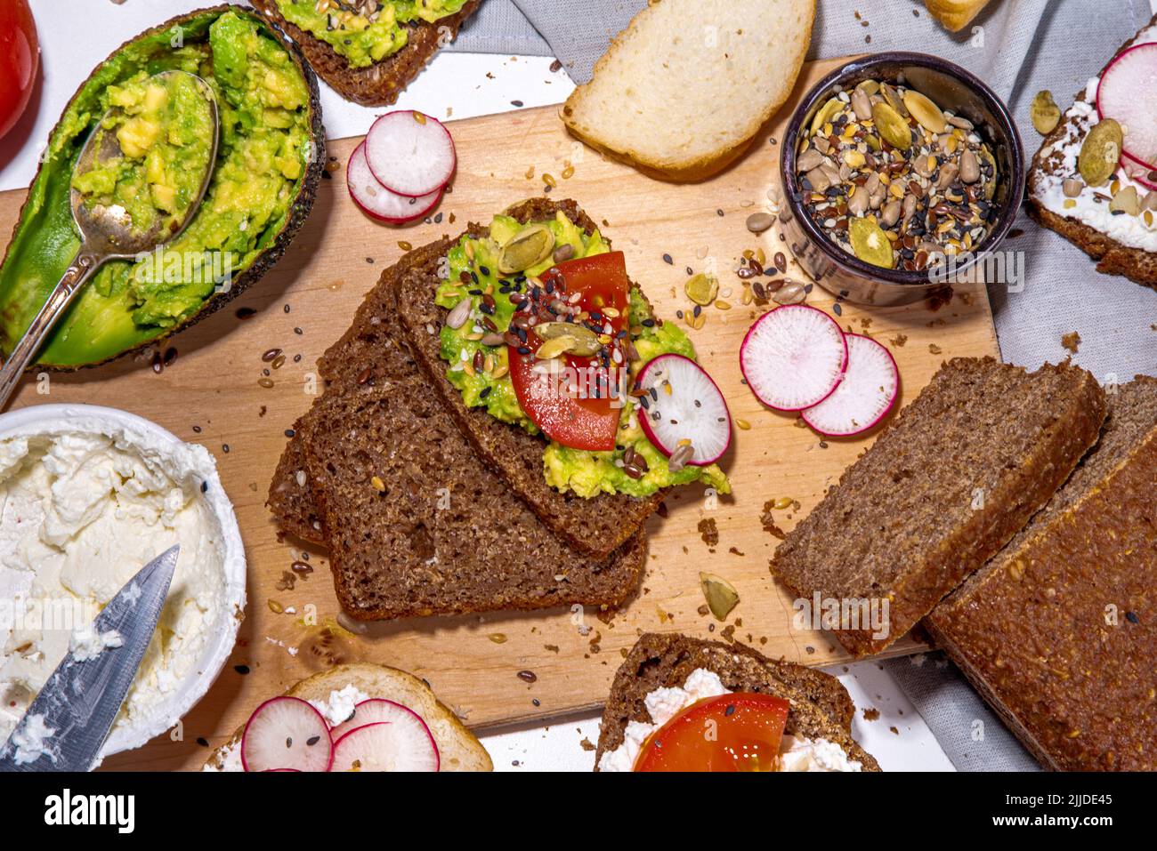 Making sandwiches for healthy diet snack. Rye and chiabatta bread with ...
