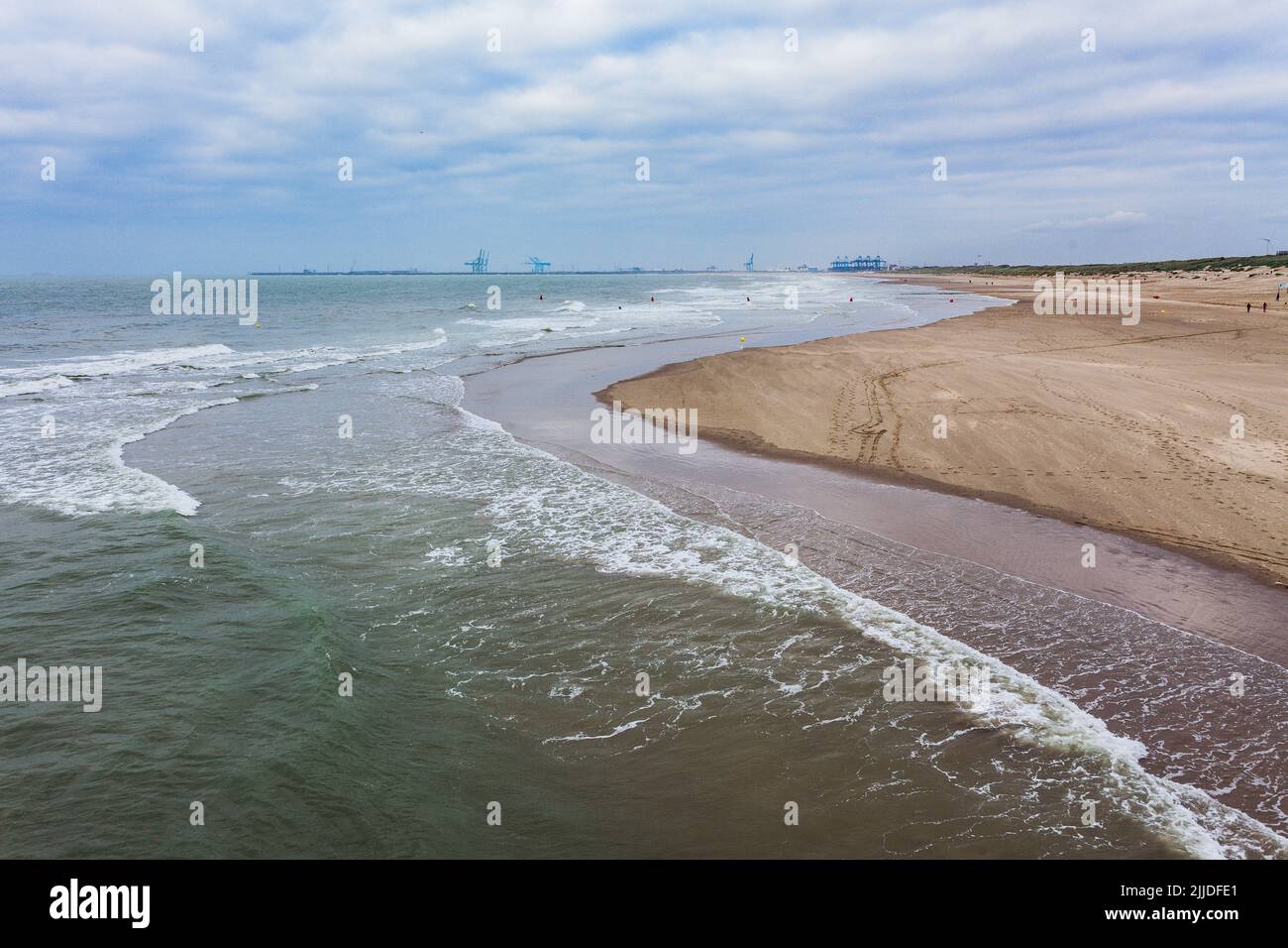 North Sea beach, Ostend, Belgium, waves crushing onto sand at sunset ...