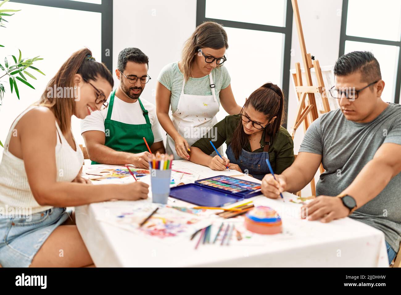 Group of draw students sitting on the table drawing at art studio Stock ...
