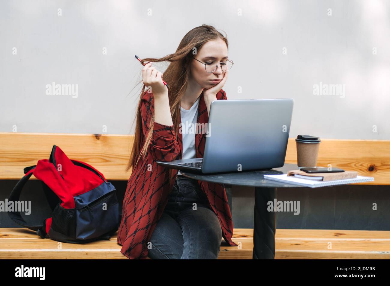 Student girl studying hard exam and sleeping on books in street cafe ...