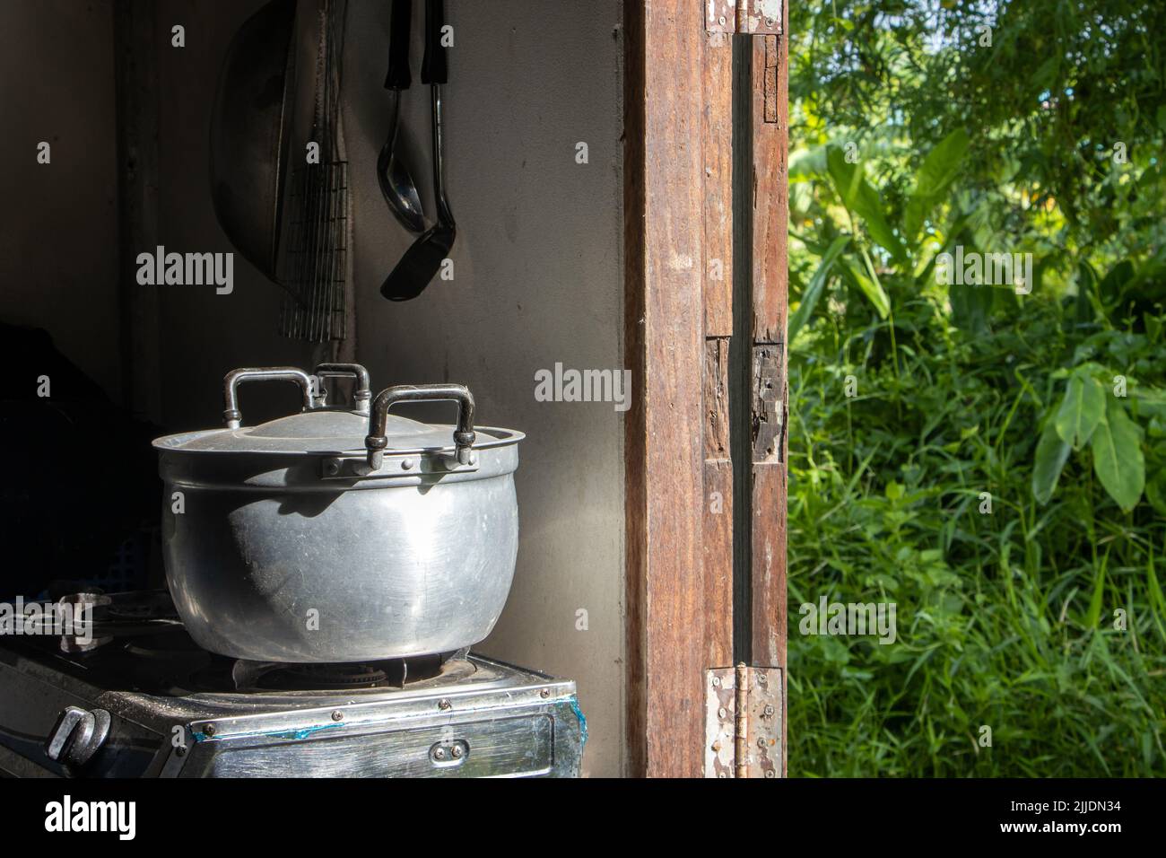 Village kitchen with the open door to a garden Stock Photo - Alamy
