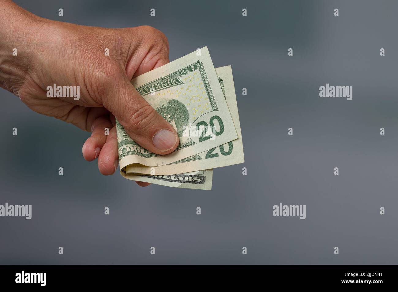 Hand holding twenty dollar bill hi-res stock photography and images - Alamy
